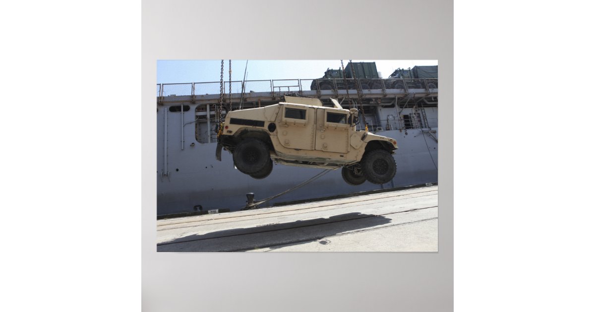 A crane lifts an M998 Humvee Poster | Zazzle