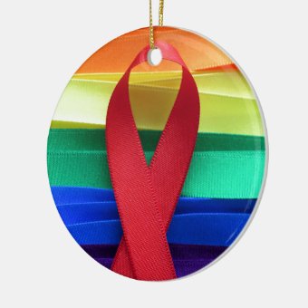 AIDS awareness red ribbon on gay flag Ceramic Ornament | Zazzle