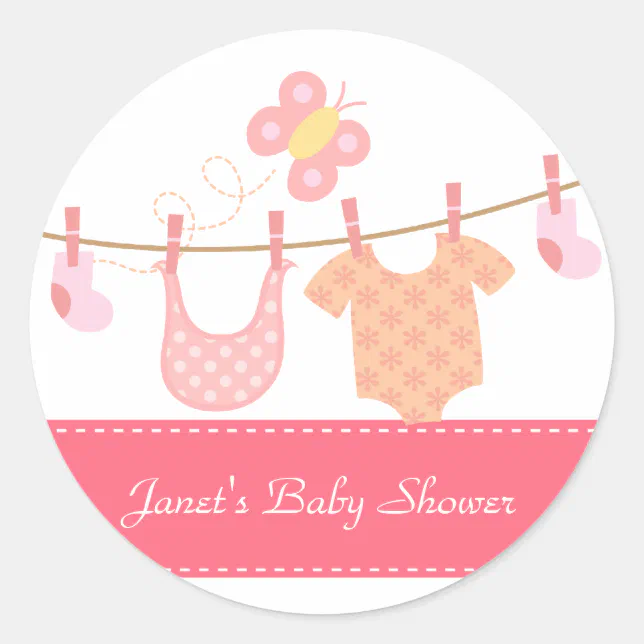 Baby clothes hanging on clothesline with butterfly classic round ...