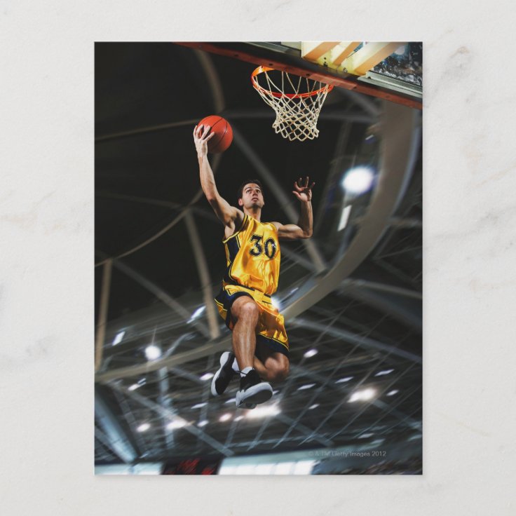 Basketball player jumping in air postcard | Zazzle