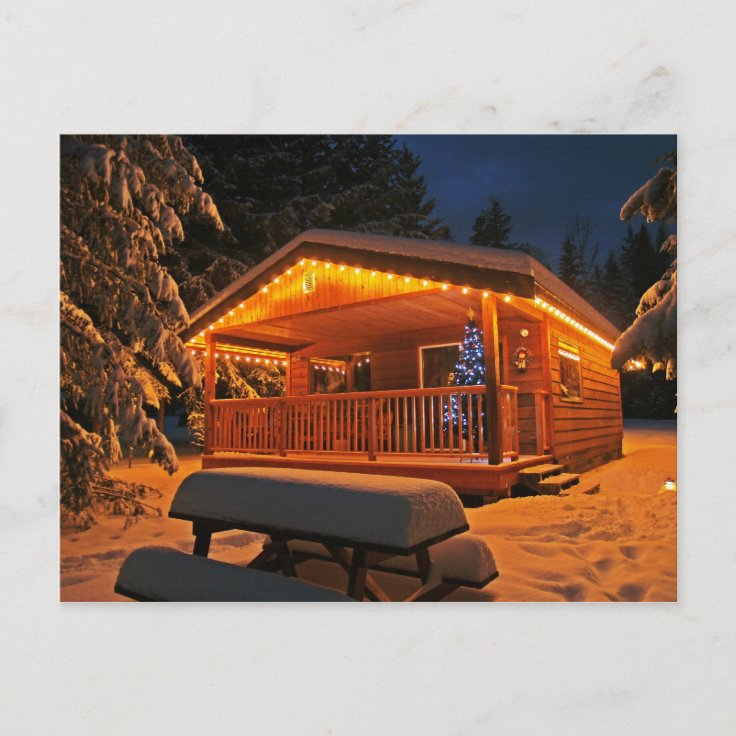 Beautiful Christmas Lights on Log Cabin in Snow Holiday Postcard | Zazzle