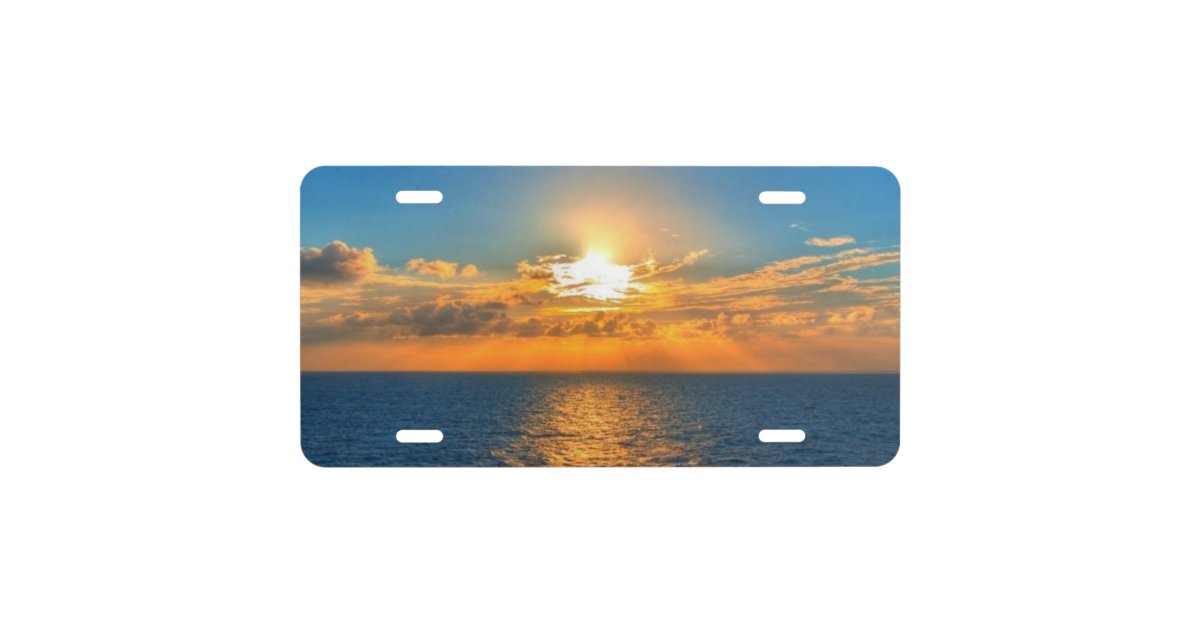 Beautiful ocean sunset license plate | Zazzle
