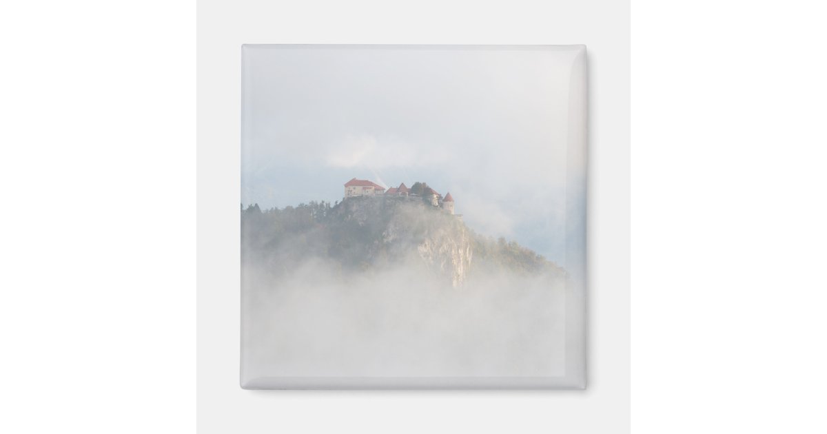 Bled castle surrounded by clouds magnet | Zazzle