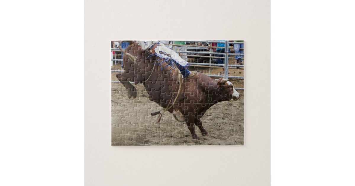 Bull rider at rodeo jigsaw puzzle | Zazzle
