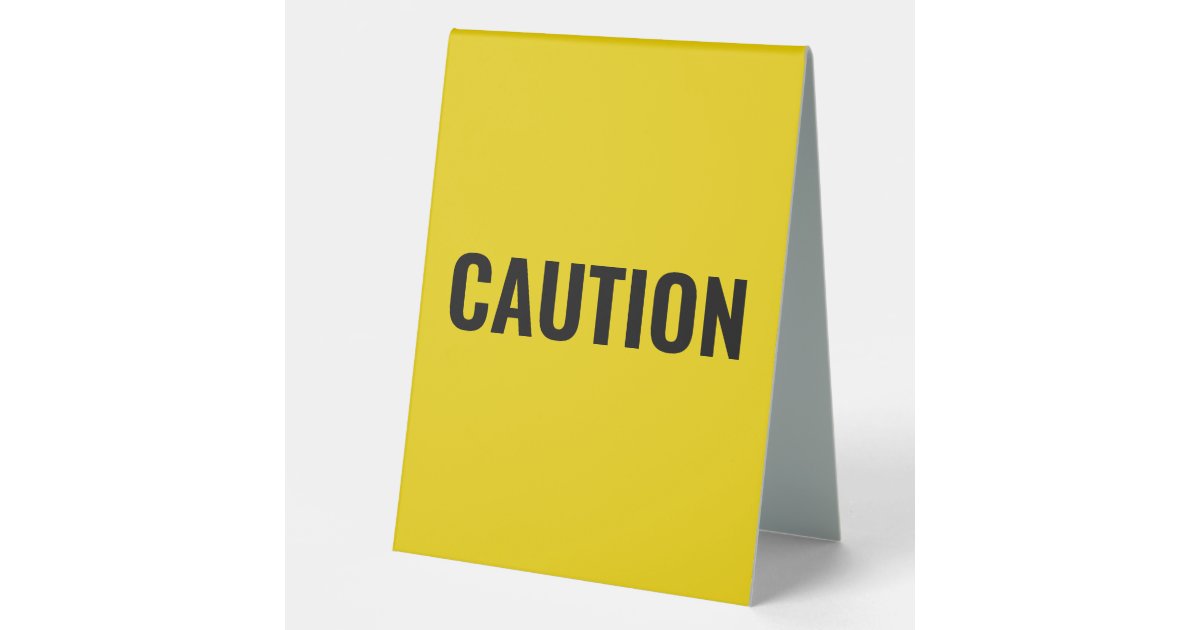 Caution black yellow warning safety table tent sign | Zazzle