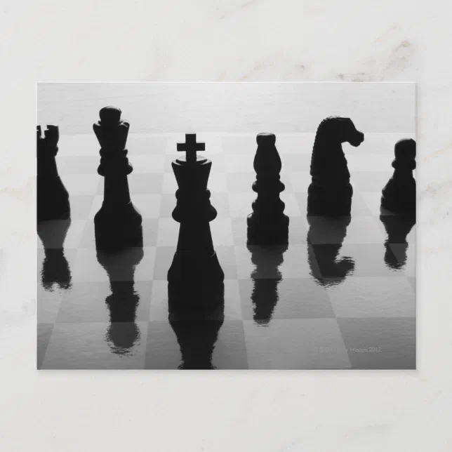 Chess pieces on chess board in black and white postcard | Zazzle