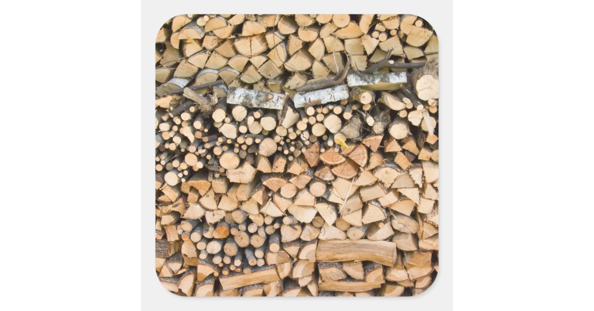 Chopped wood on a pile square sticker | Zazzle