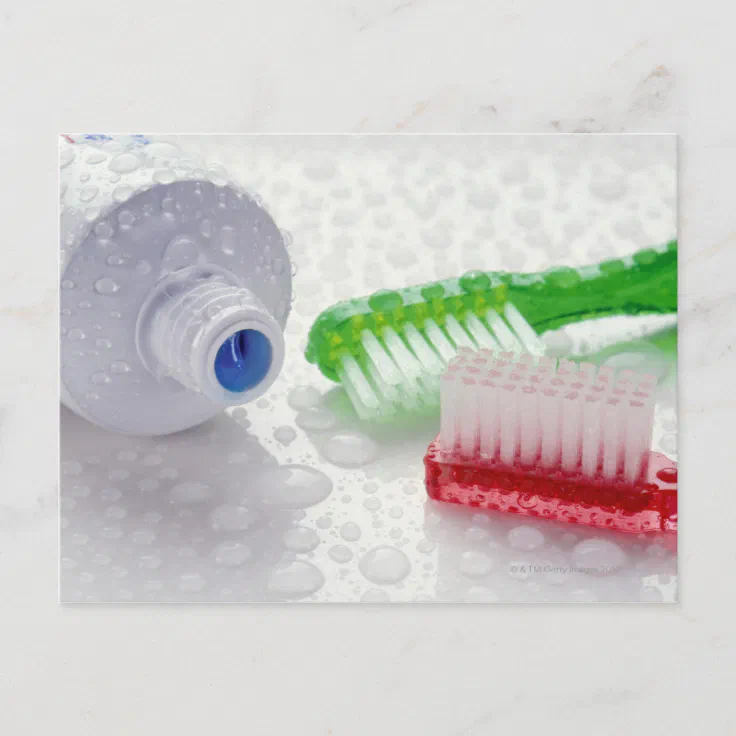 Close-up of toothpaste and toothbrushes covered postcard | Zazzle