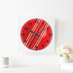 "Cricket Ball" design wall clocks | Zazzle