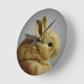 Cute Baby Bunny Rabbit in Hand Round Clock | Zazzle