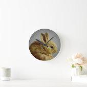 Cute Baby Bunny Rabbit in Hand Round Clock | Zazzle