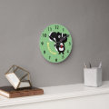 Cute happy skunk cartoon illustration round clock | Zazzle