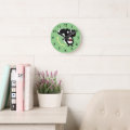 Cute happy skunk cartoon illustration round clock | Zazzle