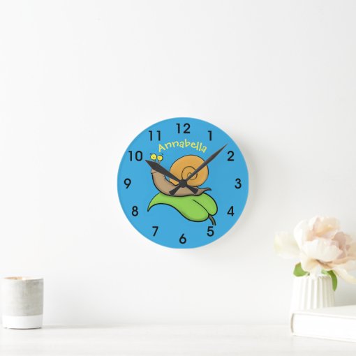 Cute, happy snail on a leaf cartoon illustration round clock | Zazzle