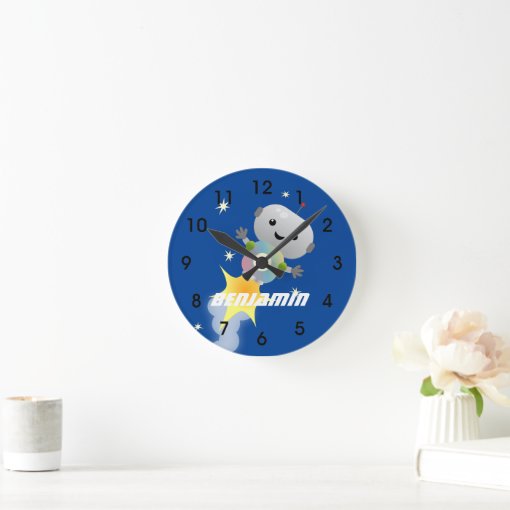 Cute robot flying in space cartoon illustration round clock | Zazzle