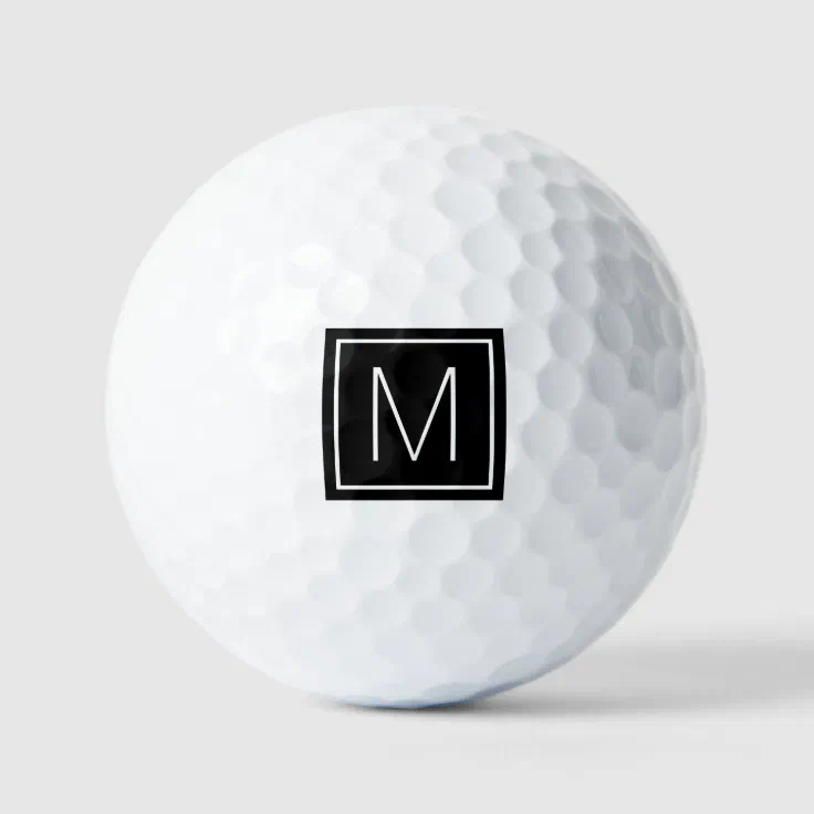Elegant monogram initial on black square golf balls | Zazzle