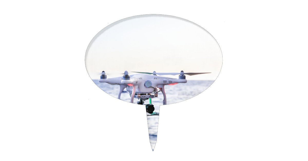 Flying drone at coast above sea cake topper | Zazzle