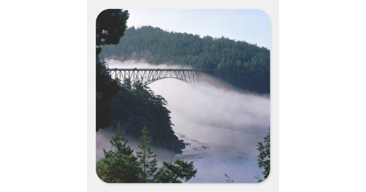 Fog drifts under the Deception Pass bridge at Square Sticker | Zazzle