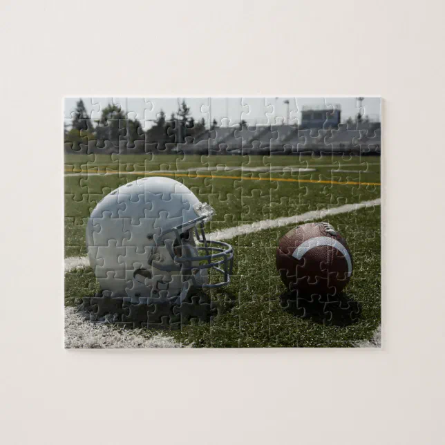 Football and football helmet on football field jigsaw puzzle | Zazzle