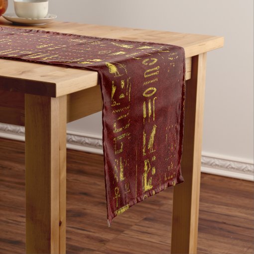 Golden Egyptian hieroglyphics on red leather Short Table Runner | Zazzle