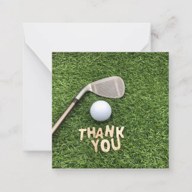 Golf ball with thank you word on green grass note | Zazzle
