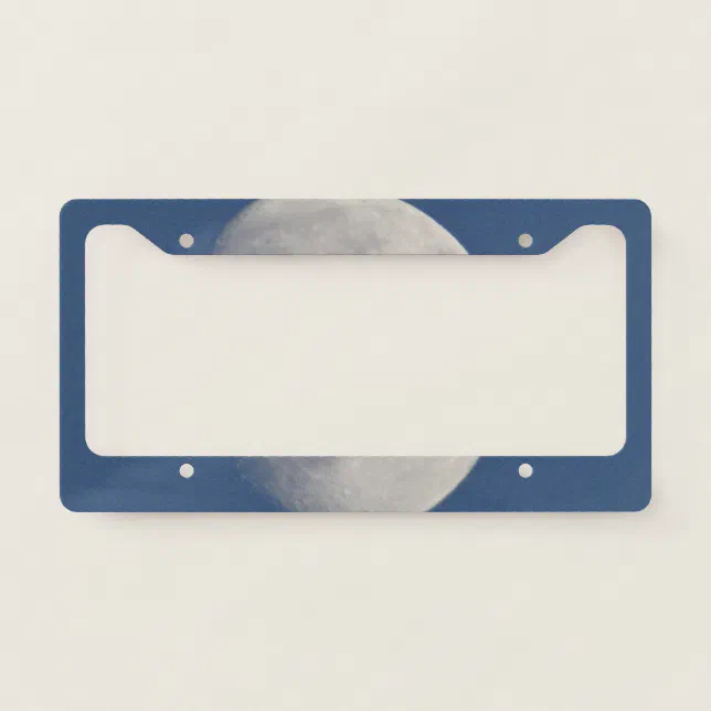 Gray moon in blue sky license plate frame | Zazzle