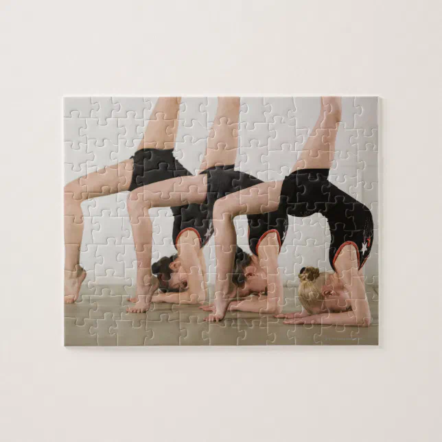 Gymnasts posing upside down jigsaw puzzle | Zazzle
