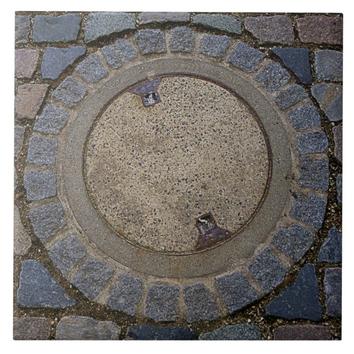 Manhole cover and cobblestone road ceramic tile | Zazzle.com