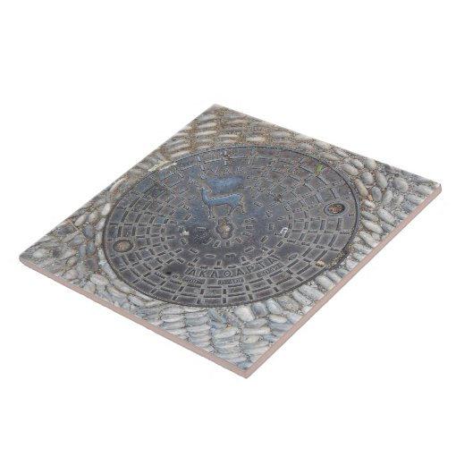 Manhole cover and cobblestone road ceramic tile | Zazzle