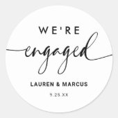 Modern Minimalist Script We're Engaged Classic Round Sticker | Zazzle