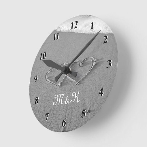Monogrammed wall clock with hearts in beach sand | Zazzle