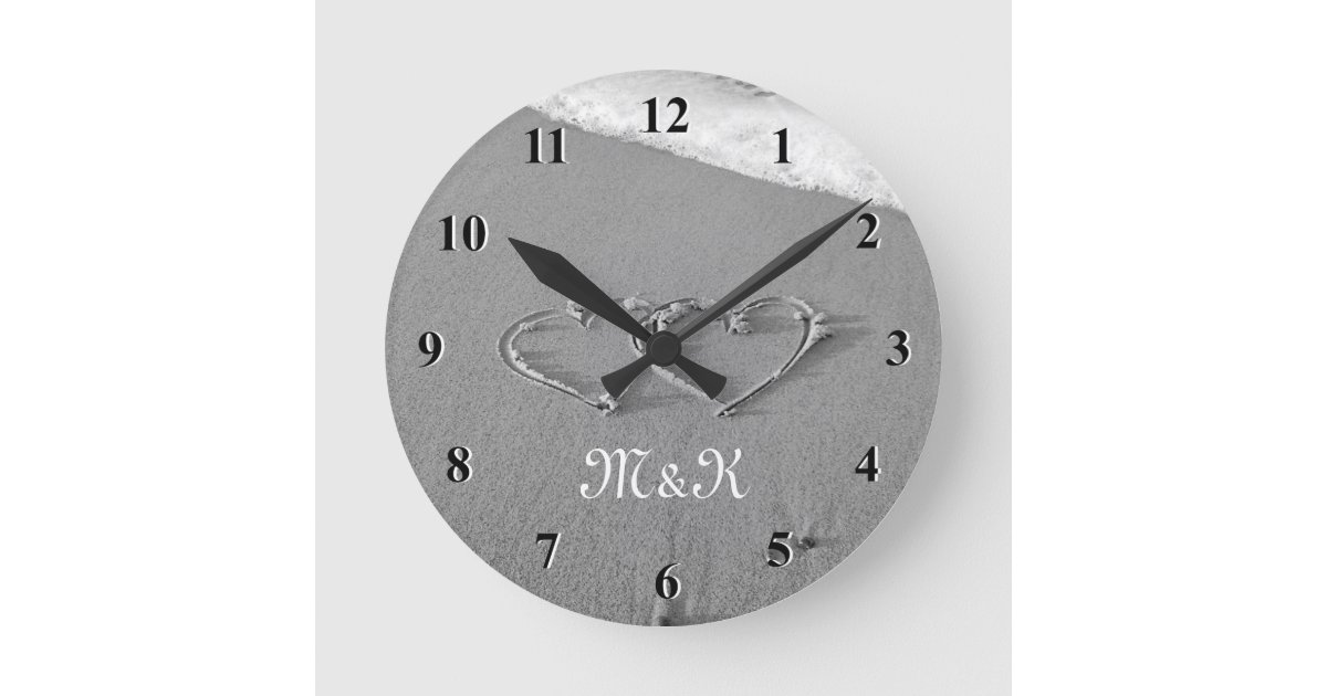 Monogrammed wall clock with hearts in beach sand | Zazzle