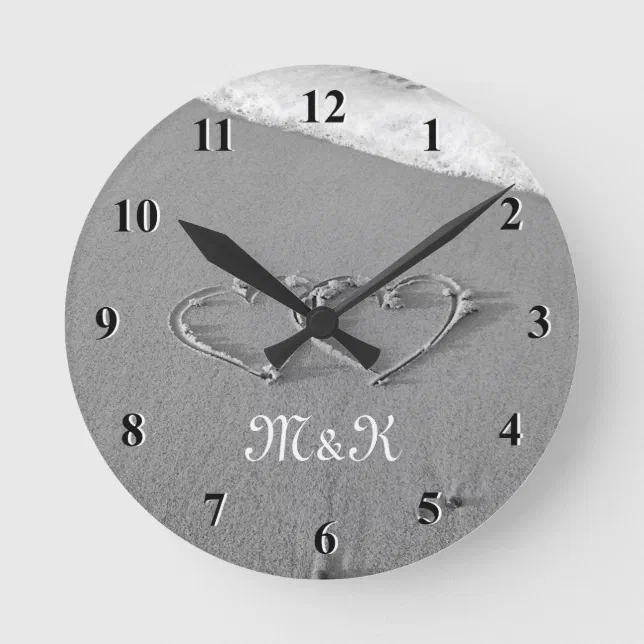 Monogrammed wall clock with hearts in beach sand | Zazzle