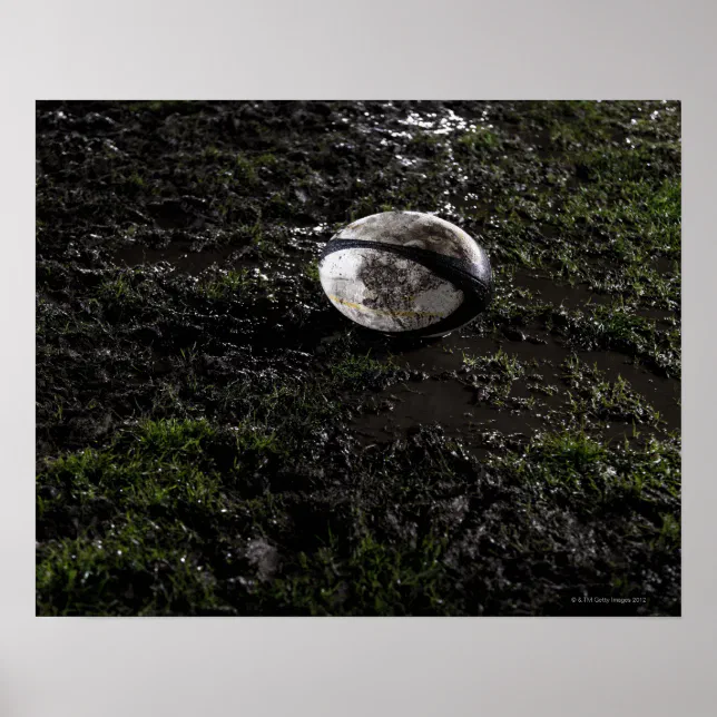 Muddy rugby ball sitting on a chewed up grass poster | Zazzle