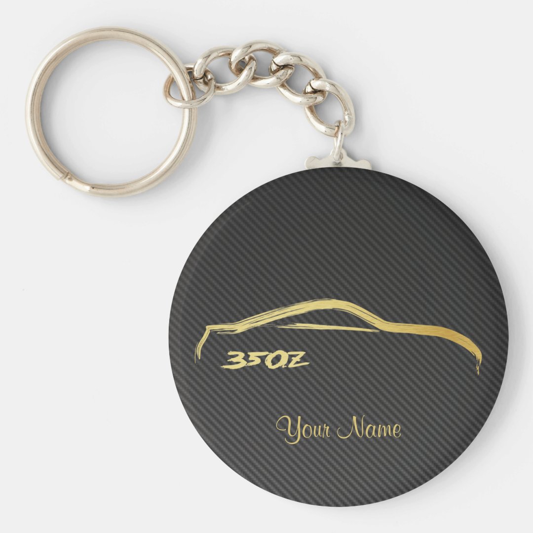 Nissan 350Z Gold Brush stroke Logo w/ faux carbon Keychain | Zazzle