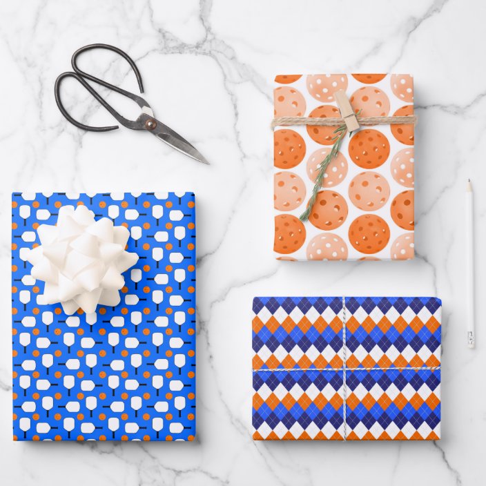 Pickleball Paddles, Orange Pickleball Balls, Blue Wrapping Paper Sheets ...