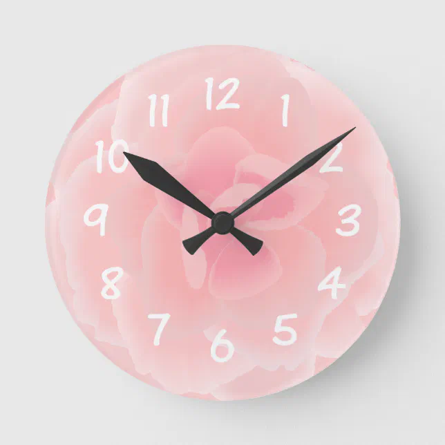 Pink flower done in watercolour effects round clock | Zazzle