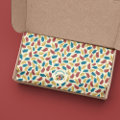 Red, Blue and Yellow Cartoon Feathers on Cream Tissue Paper | Zazzle