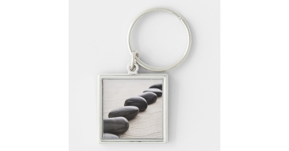 Rocks on sand keychain | Zazzle