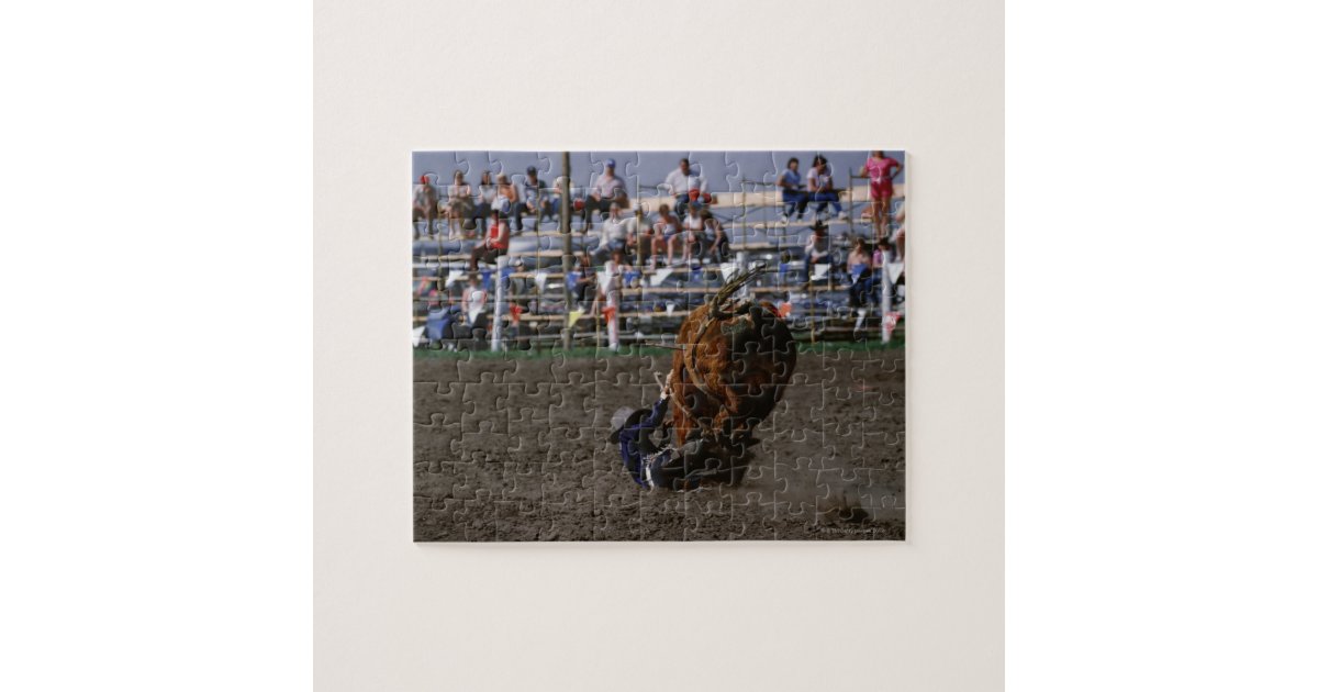 Rodeo rider falling from bull jigsaw puzzle | Zazzle