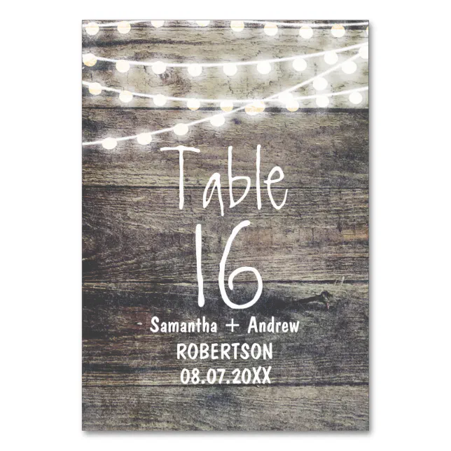 Rustic wood and string lights table number | Zazzle