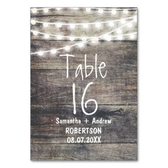 Rustic wood and string lights table number | Zazzle