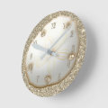 Sand dollar on sparkly gold beach sand round clock | Zazzle