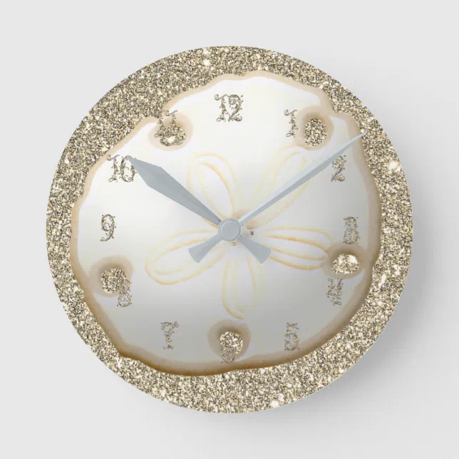 Sand dollar on sparkly gold beach sand round clock | Zazzle