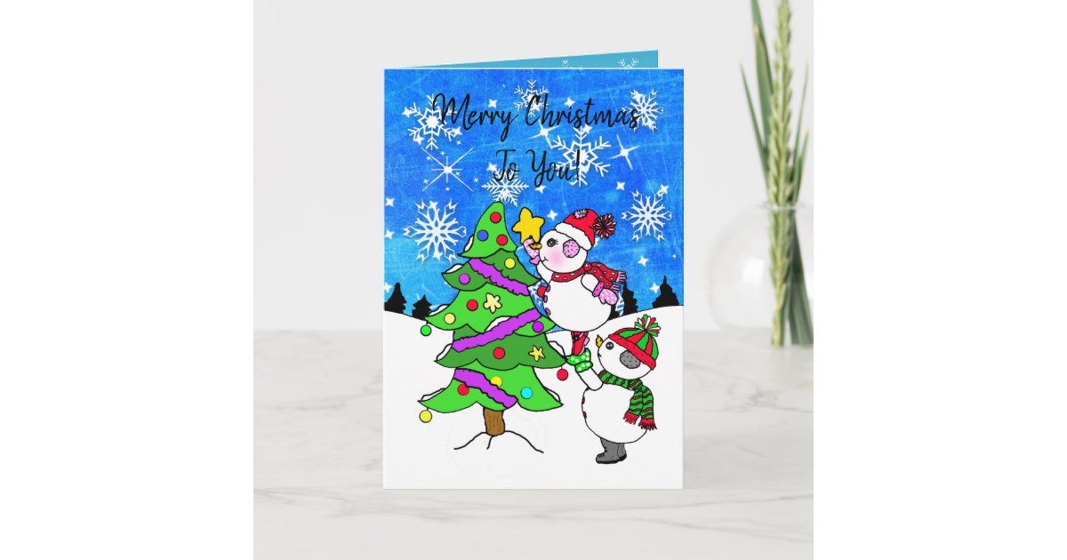 Snowman putting star on Christmas Tree Card | Zazzle