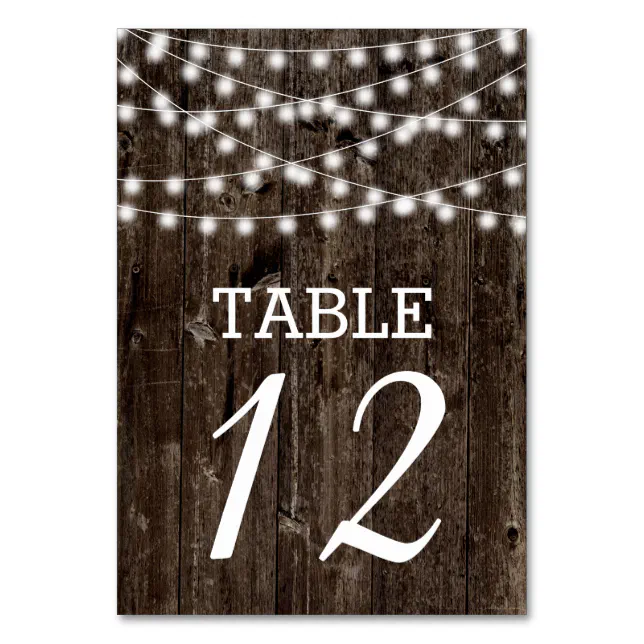 String of lights on old wood wedding table number | Zazzle
