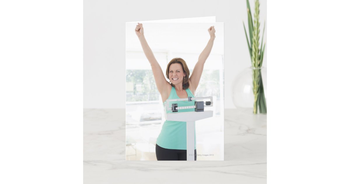 Successful weight loss. Happy woman weighing Card | Zazzle