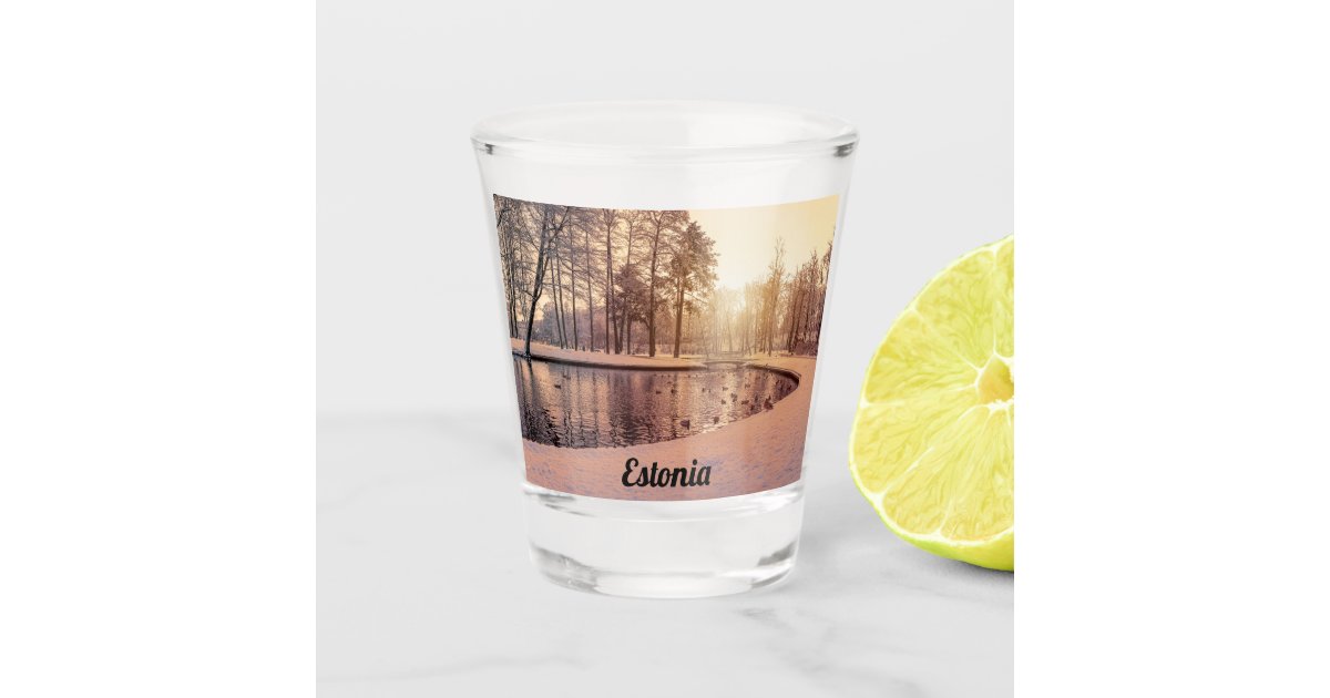 Sunset over park with small frosty lake shot glass | Zazzle