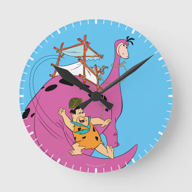 The Flintstones | Fred Sliding Down Tail Round Clock | Zazzle