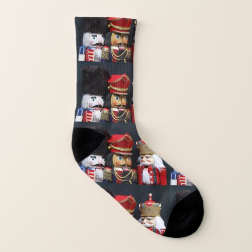 Three nutcrackers on dark background socks | Zazzle